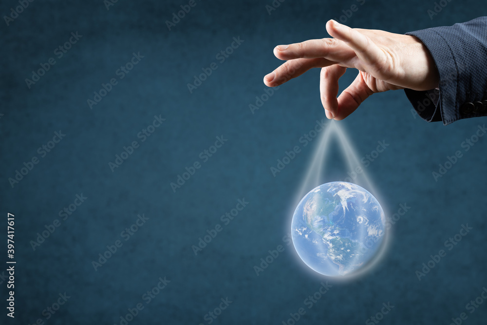 globalization, Energy and ecology concept. man's hand in suit holds the ...