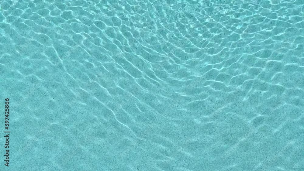 Rippled water surface in swimming pool. Blue water surface background ...