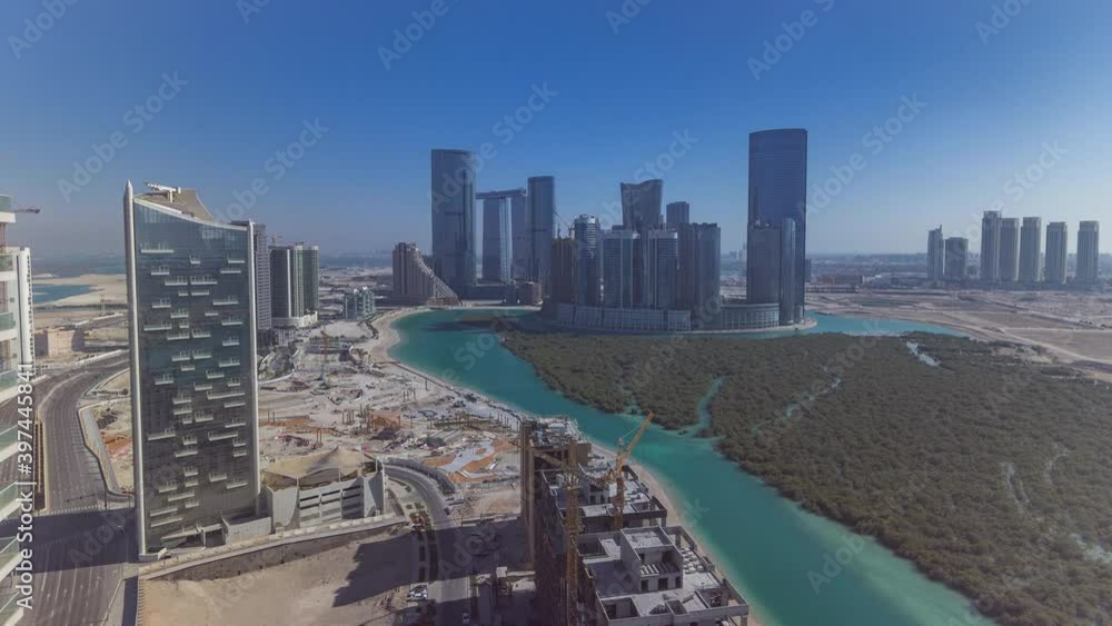 Buildings on Al Reem island in Abu Dhabi all day timelapse from above ...