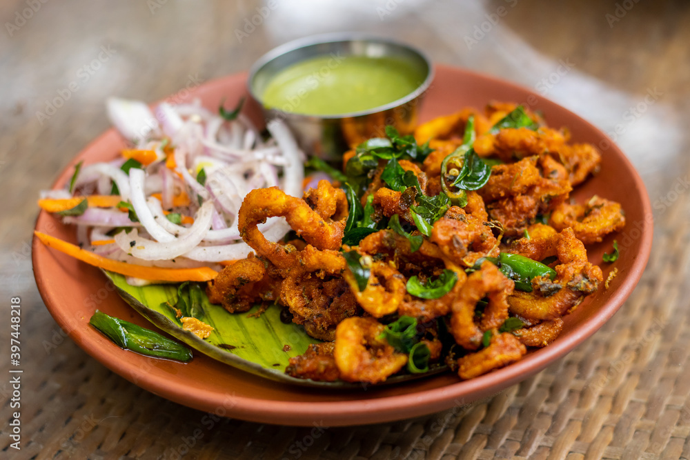 Naadan koonthal roast or Kerala spicy squid fry Stock Photo | Adobe Stock
