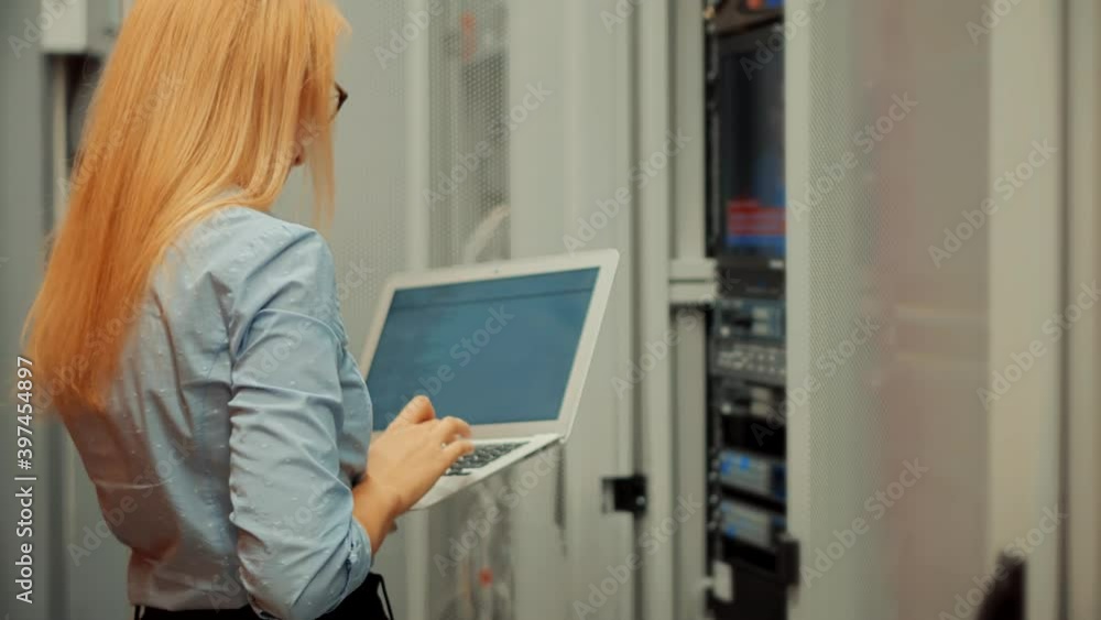 Woman It Engineer Working In Server Room.Network Engineer Work In Data ...