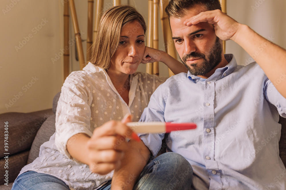 Unwanted pregnancy, contraception fail, safe concept. Frustrated couple ...