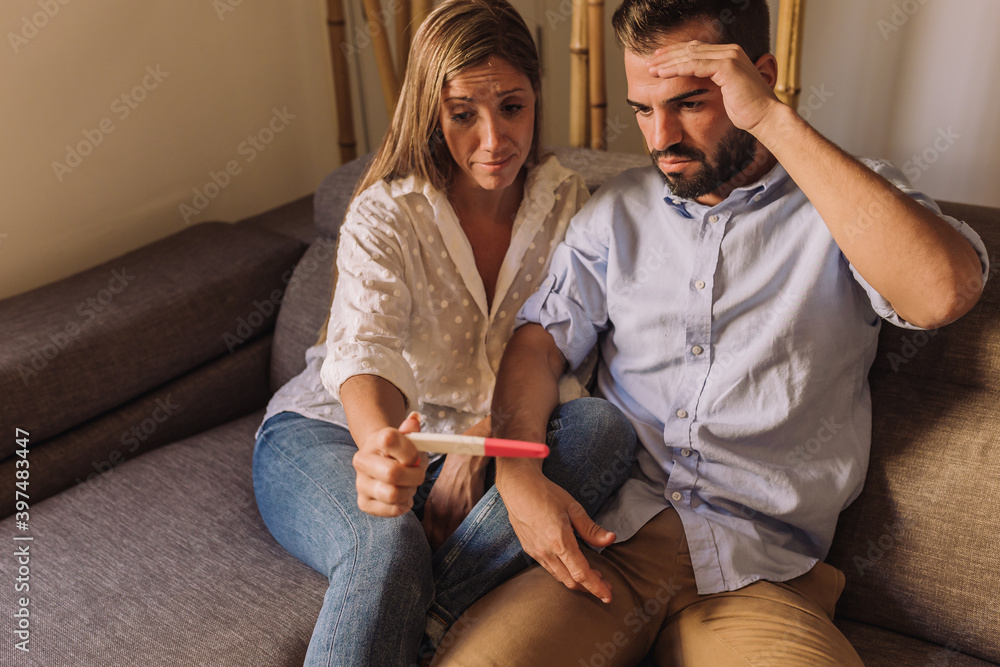 Unwanted pregnancy, contraception fail, safe concept. Frustrated couple ...