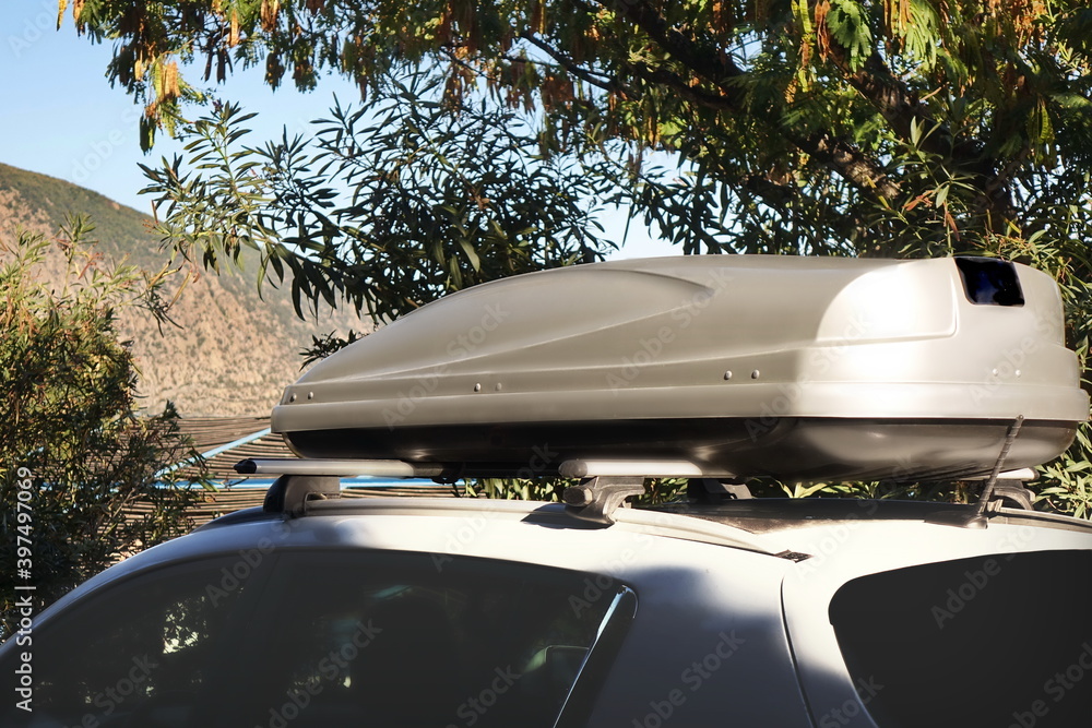 Car Trunk Box On Roof. 4WD Car With Luggage Box On Rooftop Fastening To ...