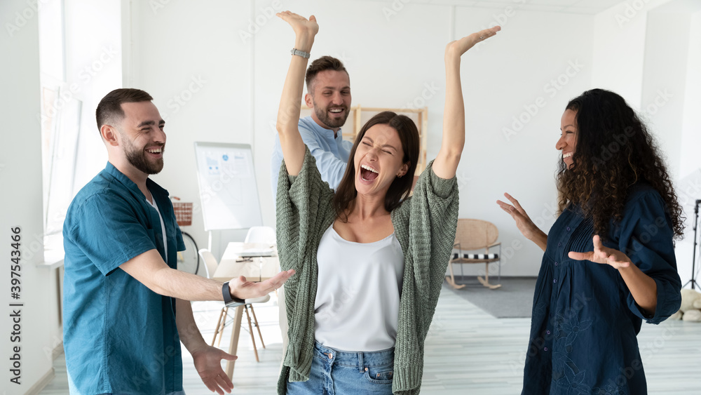 Banner panoramic view of overjoyed multiracial young employees have fun ...