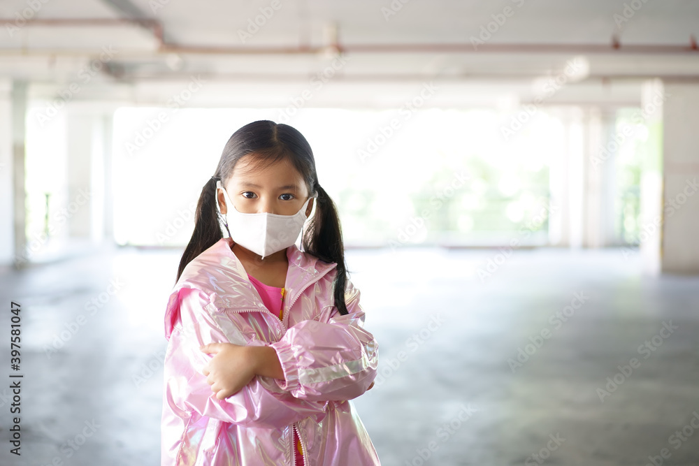 Asian child or kid girl wearing N95 white face mask and coat sweater to ...