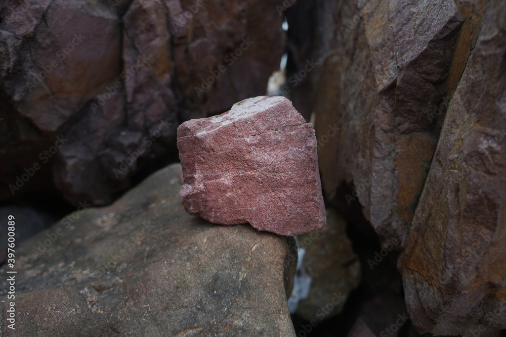 piece of Pink Arkose Sandstone rock on nature background. Sandstones ...