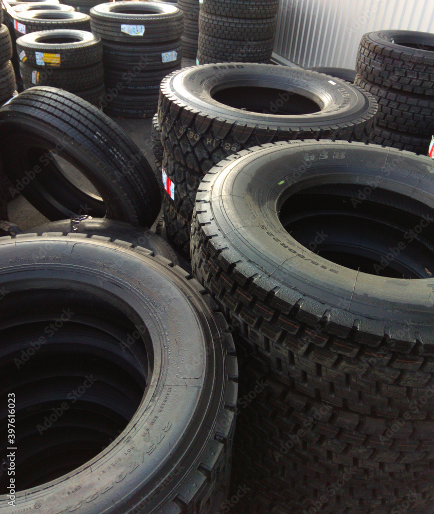 Large modern warehouse with forklifts and stack of car tires Stock ...