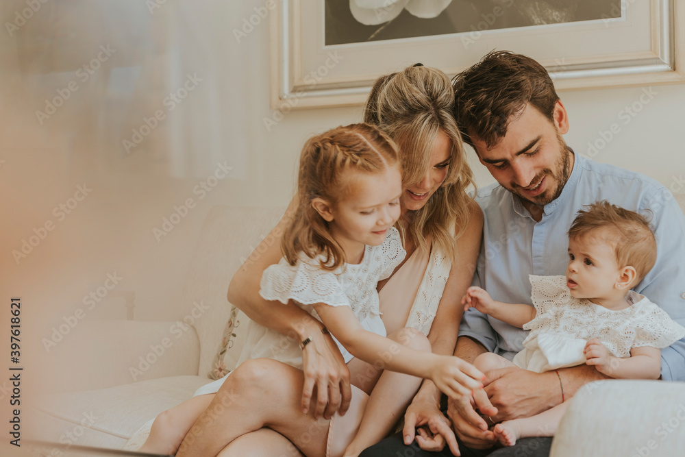 family with children - little girls having a free moment of intimacy ...