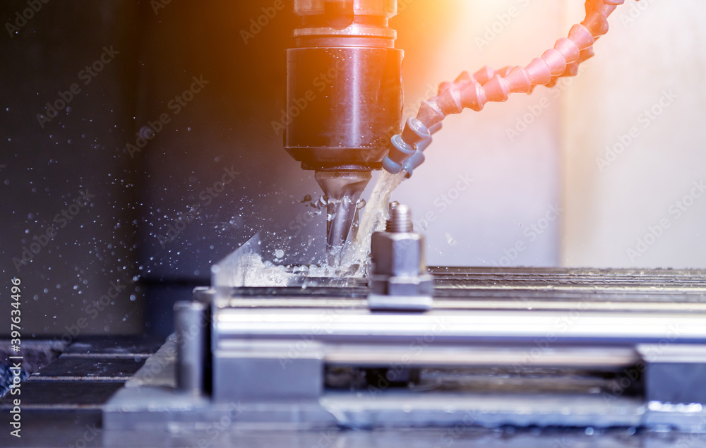 CNC milling machine drills holes in the pipe. Stock Photo | Adobe Stock