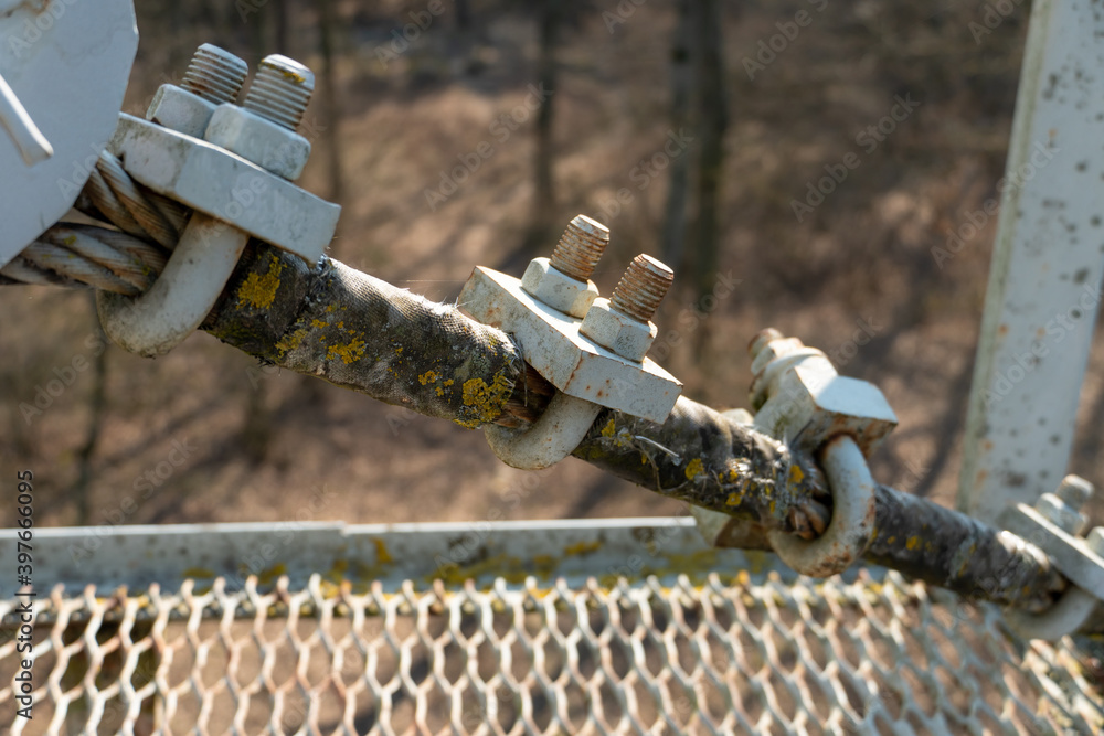 Cables and ropes of the suspension bridge close-up. Repair of the old ...