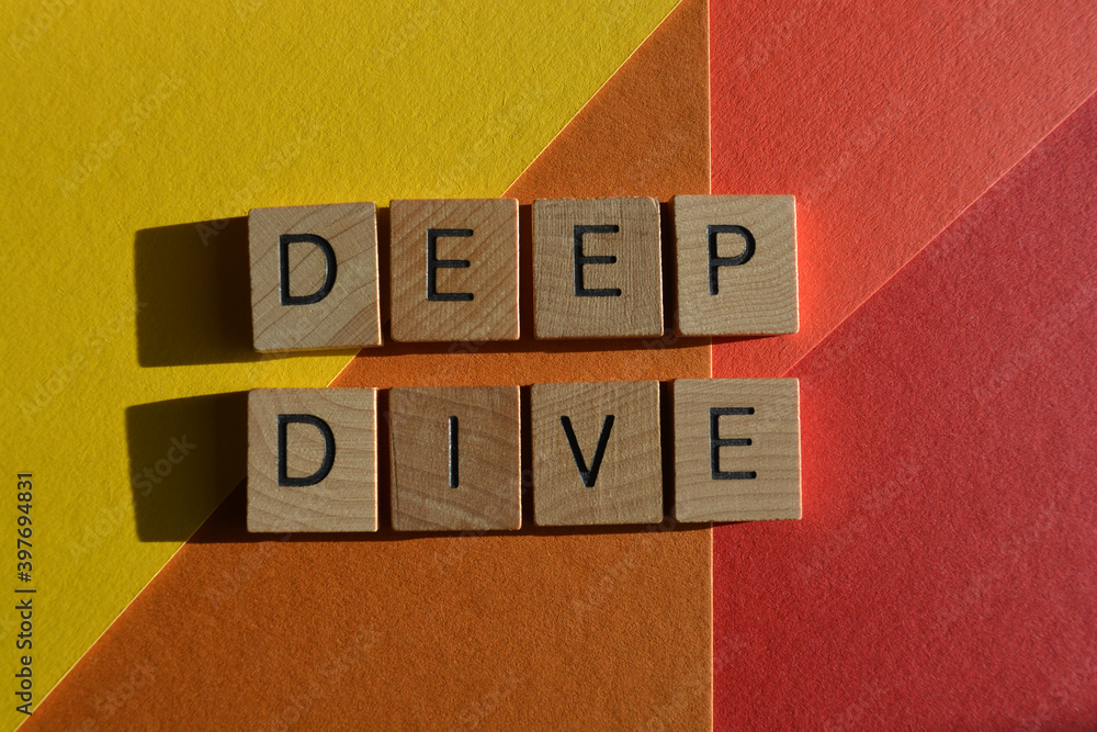 Deep Dive, words in wooden alphabet letters isolated on colourful ...
