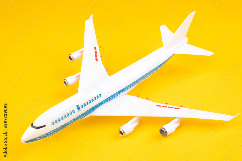 Airplane on a yellow background. Concept - air traffic. Concept - air ...