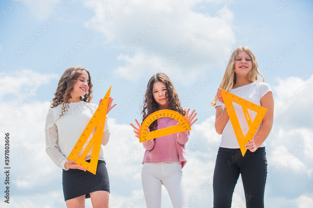 high school. three girls with protractor and triangle ruler. back to ...