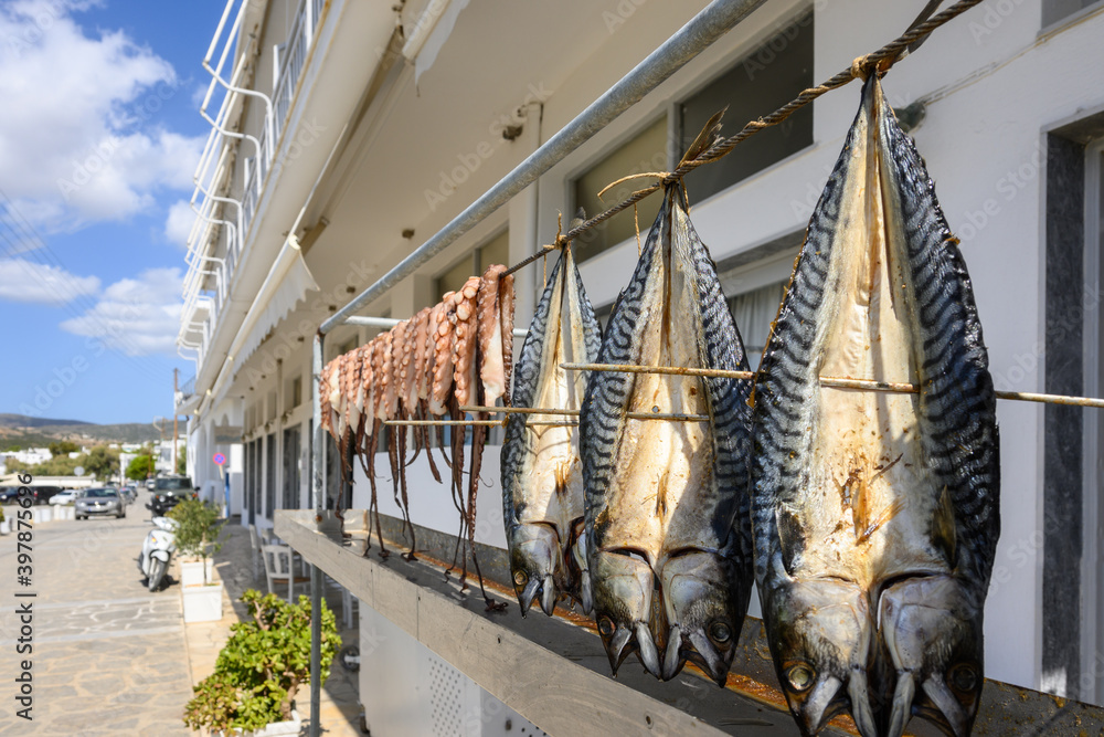 Drying fish and octopus on the street in Aliki village. Paros Island ...