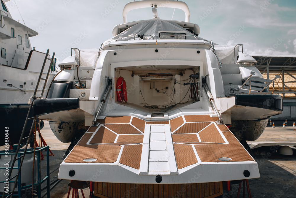 Rear view of the yacht. Small size of yacht interior from outside rear ...