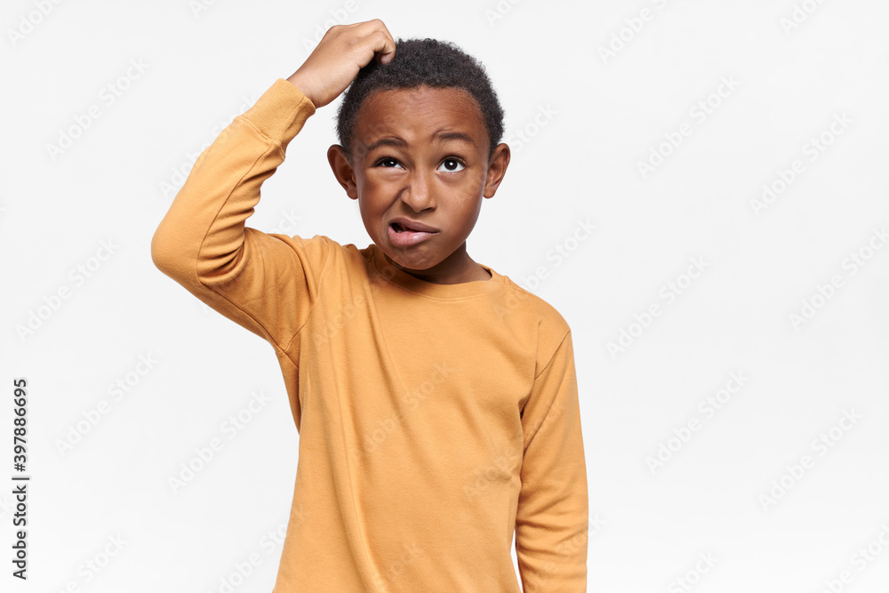 Isolated image of perplexed frustrated African American schoolboy ...