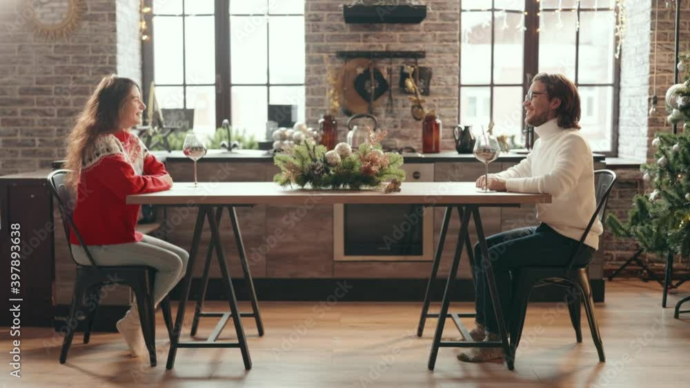 Young couple keep social distance while celebrating xmas at home. Two ...