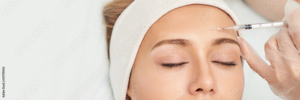 Forehead injection at spa salon. Doctor hands. Closeup. High quality ...
