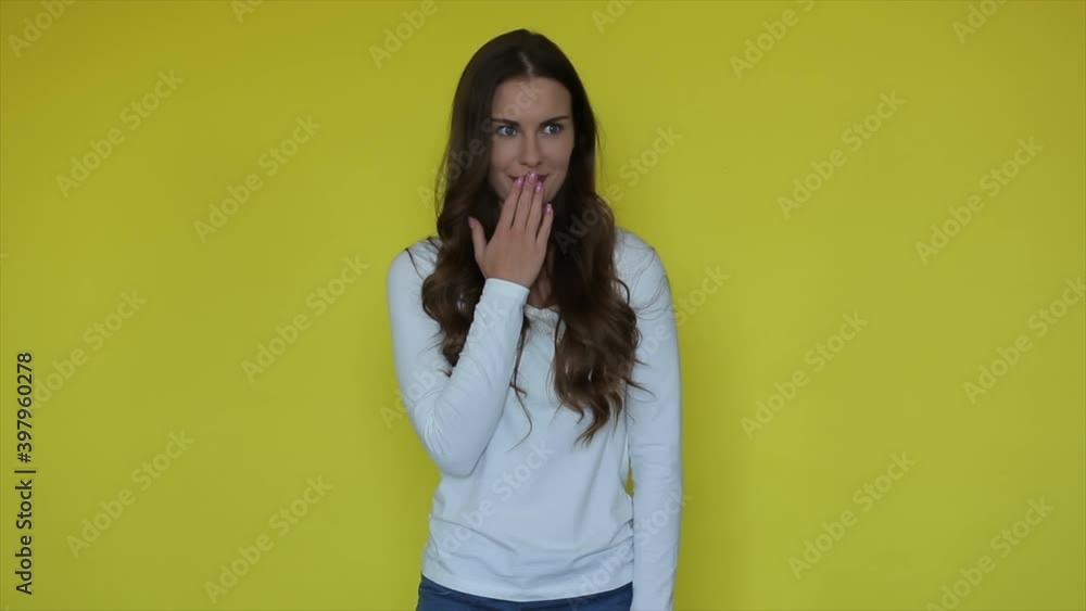 Oops woman face in yellow studio. Portrait of exited woman expression ...