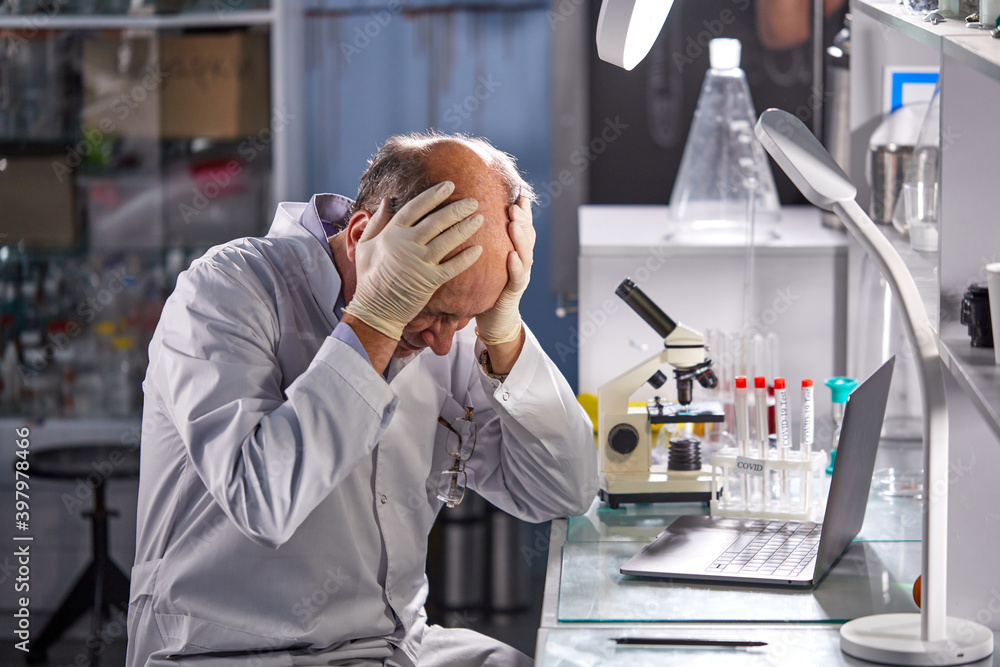 lab technician in tense in the chemical laboratory, worried by ...