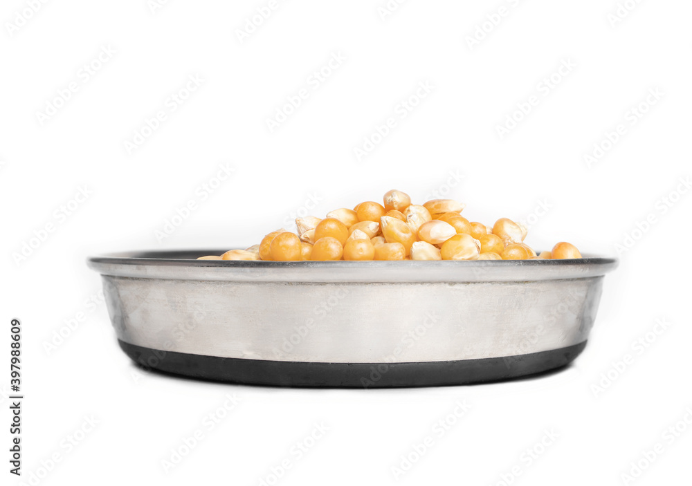 Pet food dish filled with corn kernels, perspective view. Concept for ...
