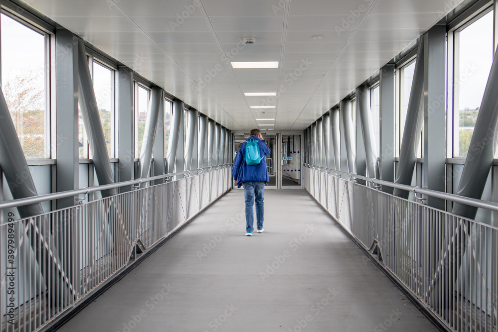 Raised walkway bridge for pedestrians viewed from the inside interior ...