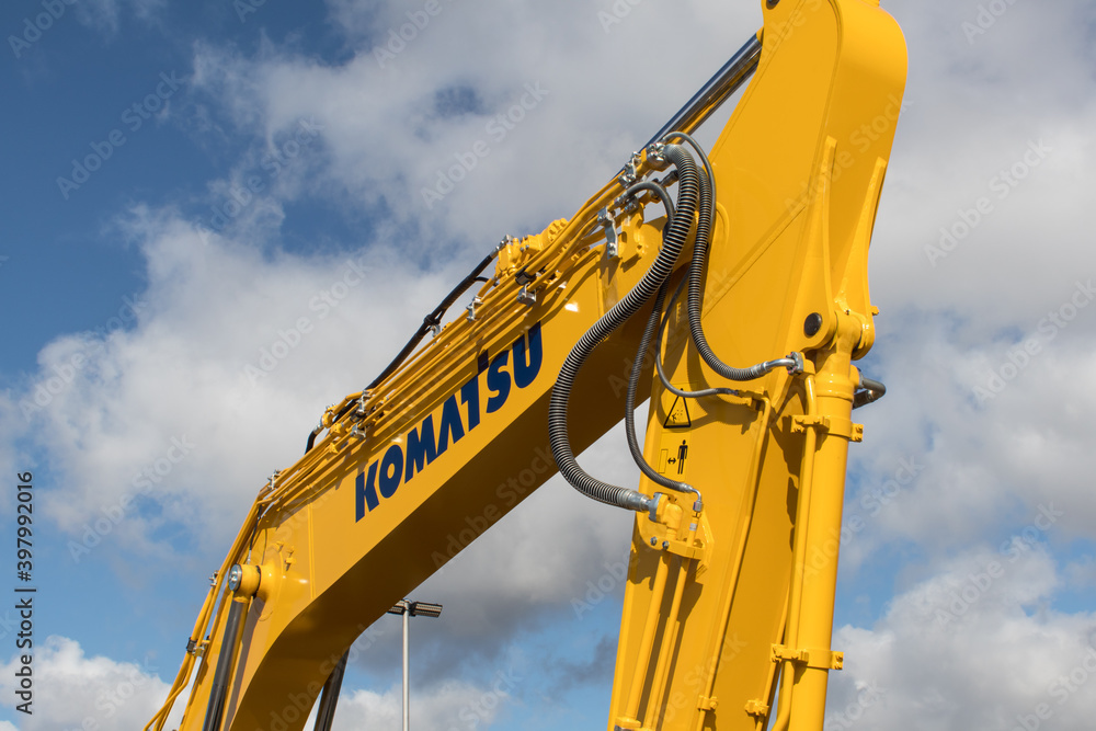 Large yellow Komatsu industrial digger machine showing company name ...