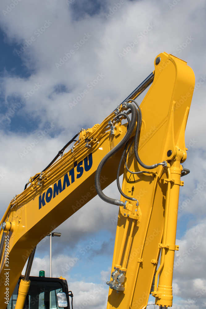 Large yellow Komatsu industrial digger machine showing company name ...