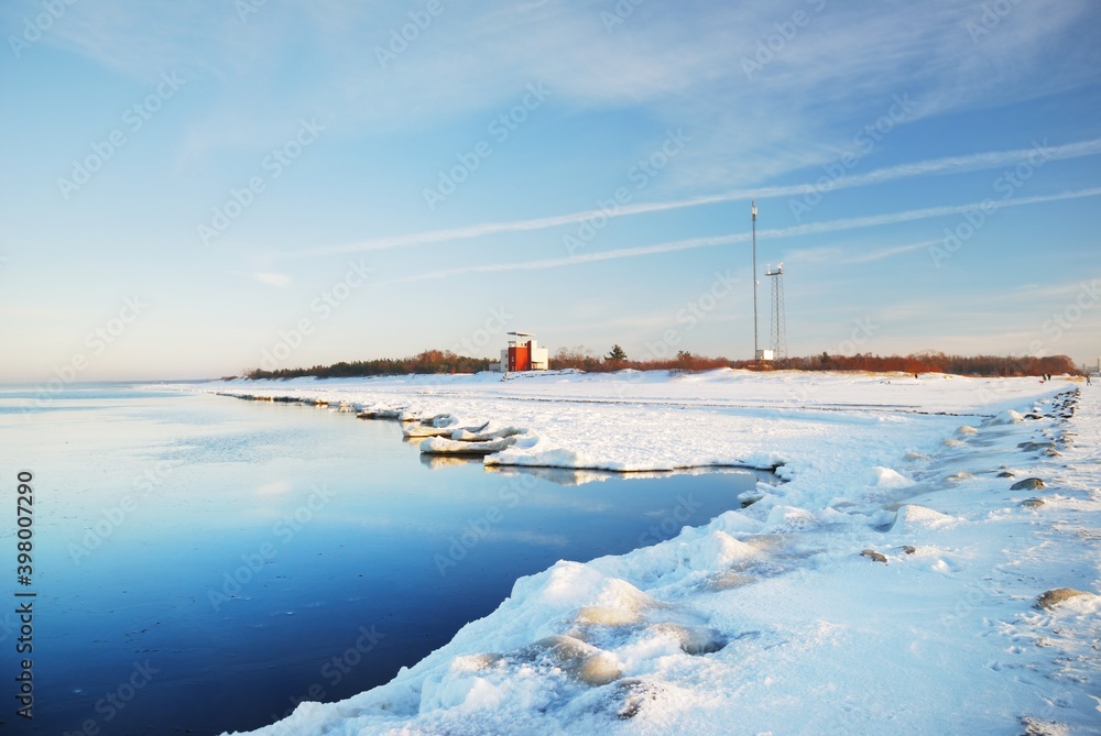 Meteorological station on the frozen sea shore on a clear day. Concept ...