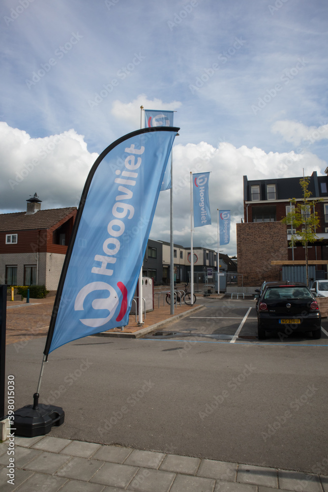Advertising flags for Hoogvliet in customer car park showing company ...