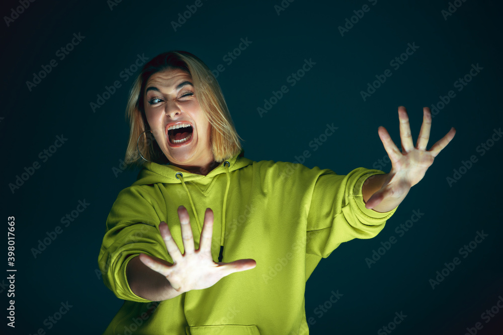 Trying to run. Portrait of young crazy scared and shocked caucasian ...