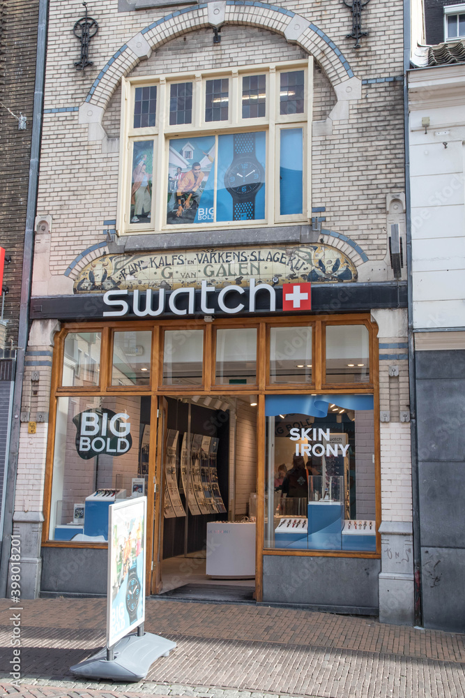 Exterior facade of Swatch watch shop showing entrance, window display ...