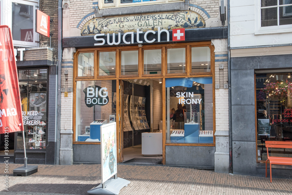 Exterior facade of Swatch watch shop showing entrance, window display ...