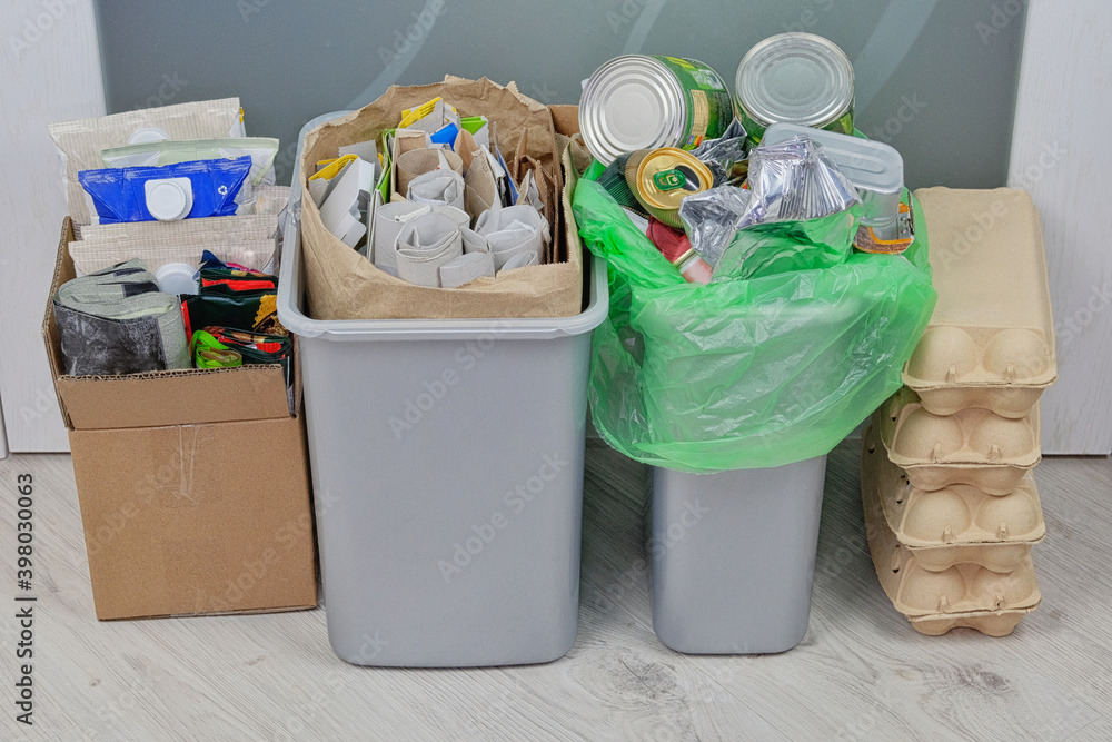 Various garbage for recycling in box. Paper, cardboard, metal and glass ...