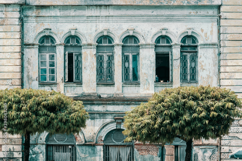 Old dilapidated colonial building in a street of Yangon, Burma, Myanmar ...