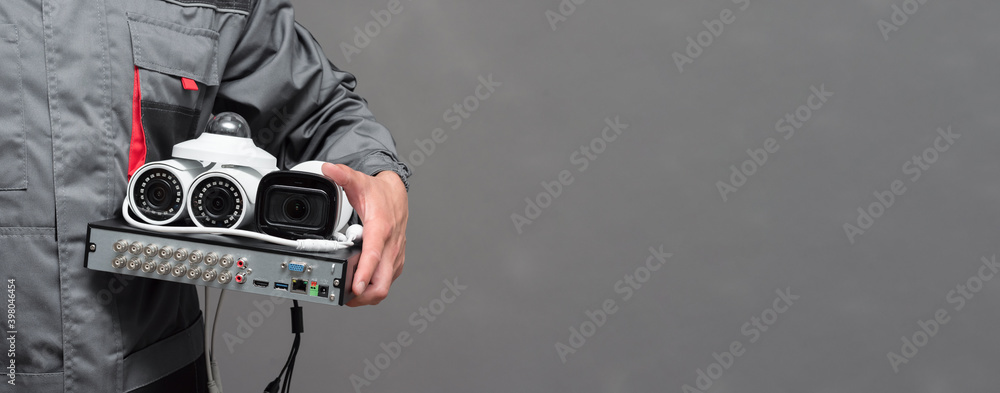 CCTV camera and video surveillance equipment in the worker hands on the ...