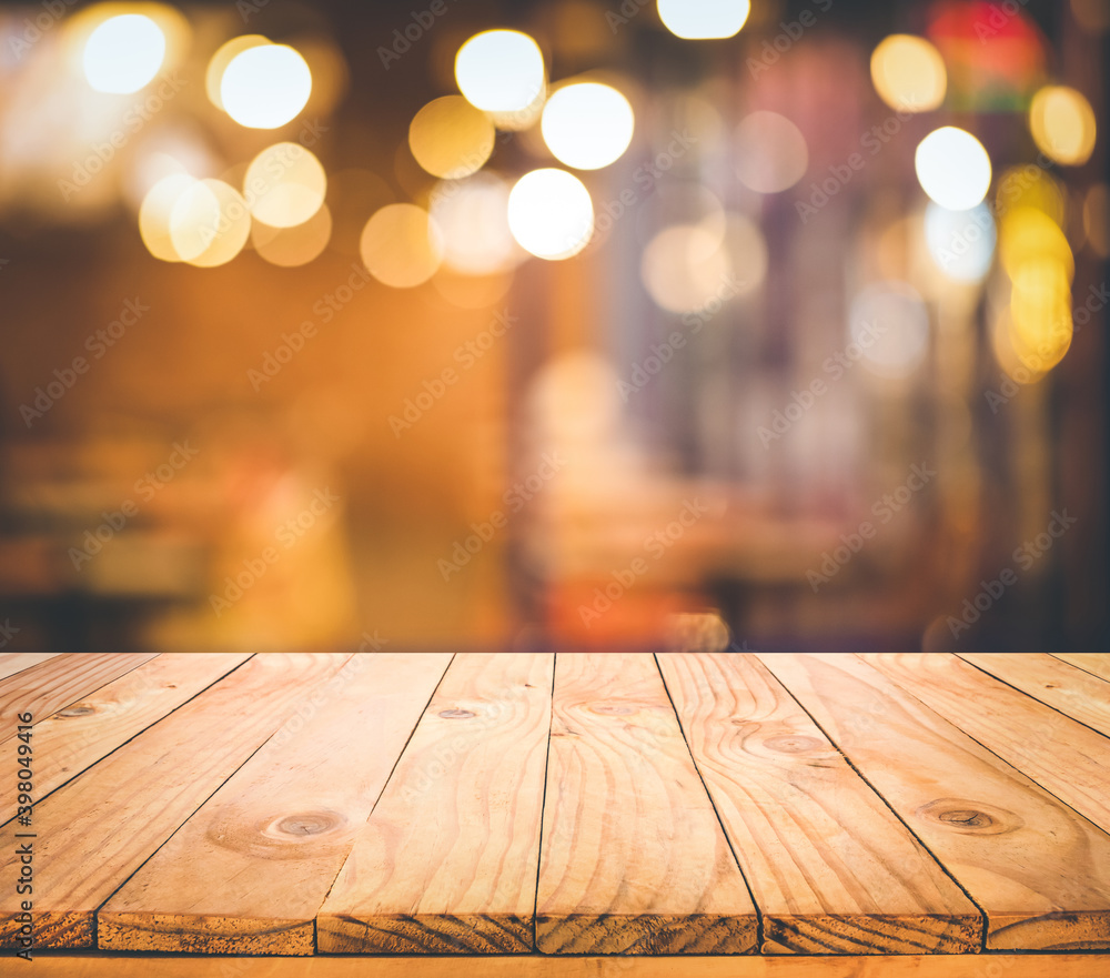 Wood table top (Bar) with blur light bokeh in dark night cafe ...