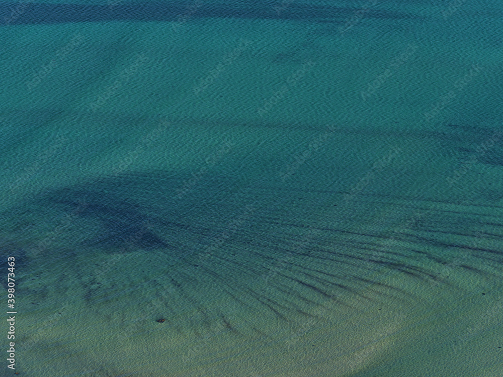 Beautiful aerial view of shallow textured water with turquoise and blue ...