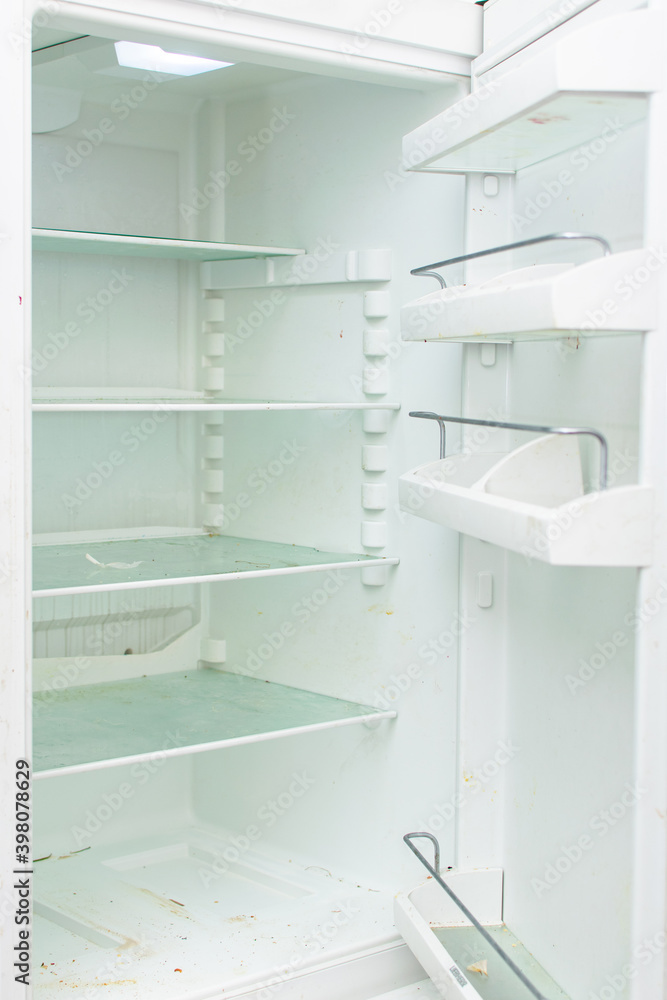 Dirty empty open fridge. Condition before cleaning inside. Stock Photo ...