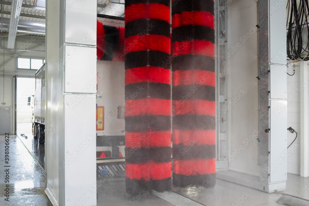 Car wash of trucks under high pressure water. Contactless car wash with ...