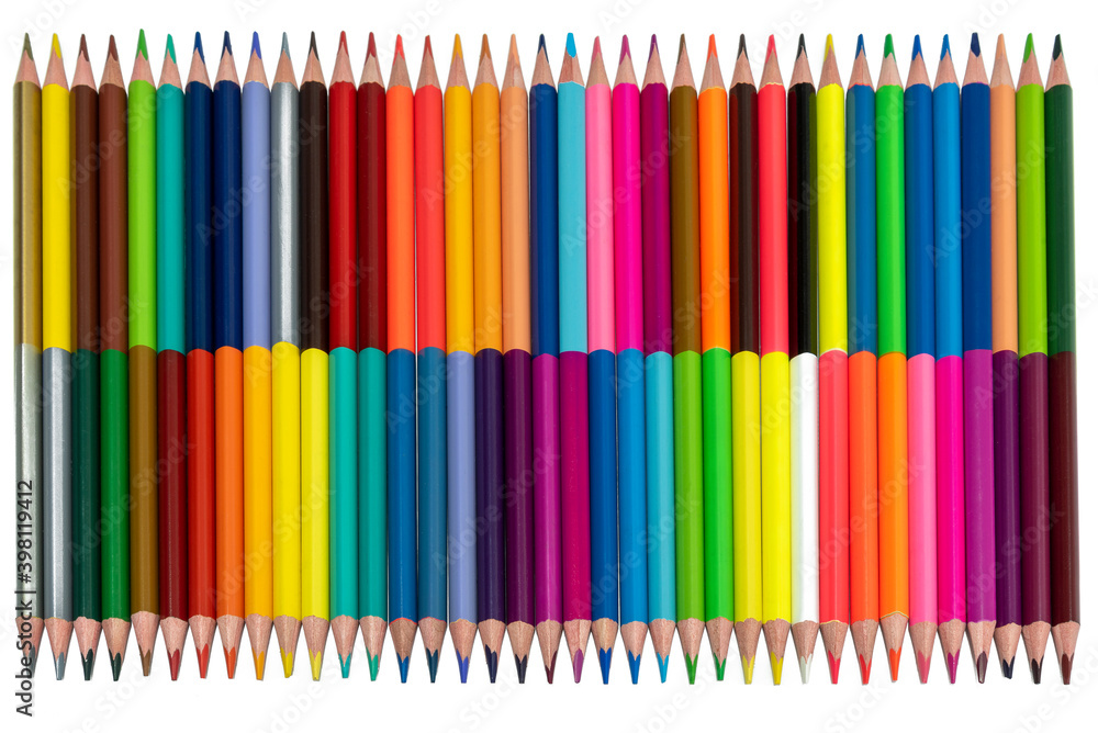 double-sided colored pencils on one side are laid out in order on the ...