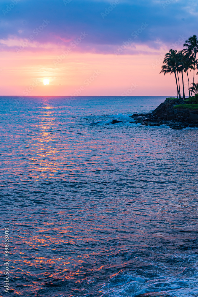 Tropical pink sunset over ocean with island of palm trees Stock Photo ...
