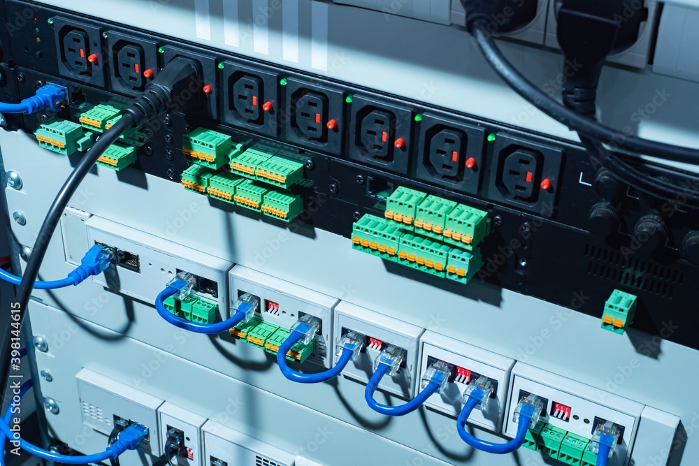 Network hardware. Close-up panel with electrical and network ...