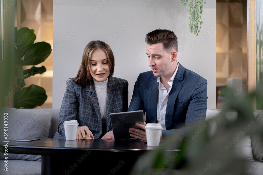 Two professional business people working together in office. Indoor ...