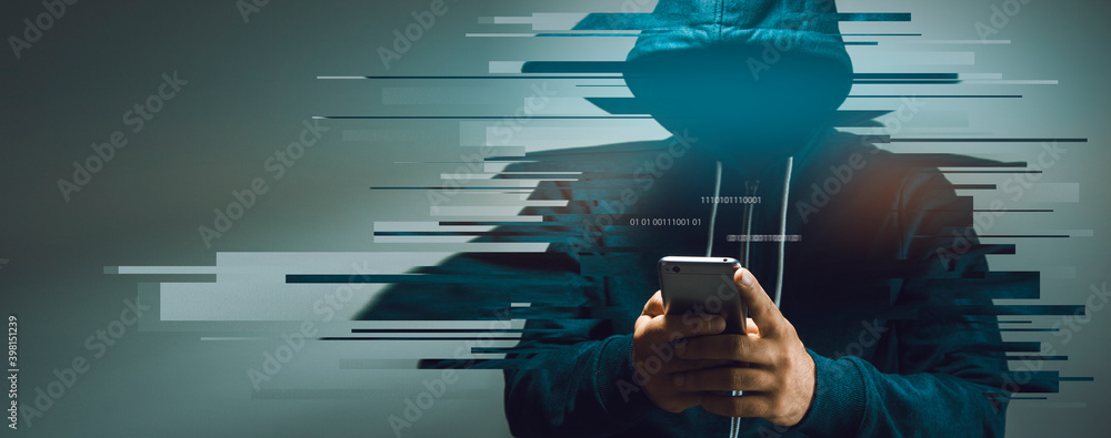 the hacker holding smart phone Stock Photo | Adobe Stock