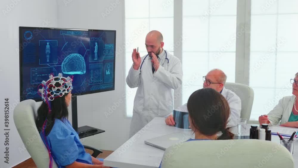 Female nurse wearing scaning headset for brain activity during ...