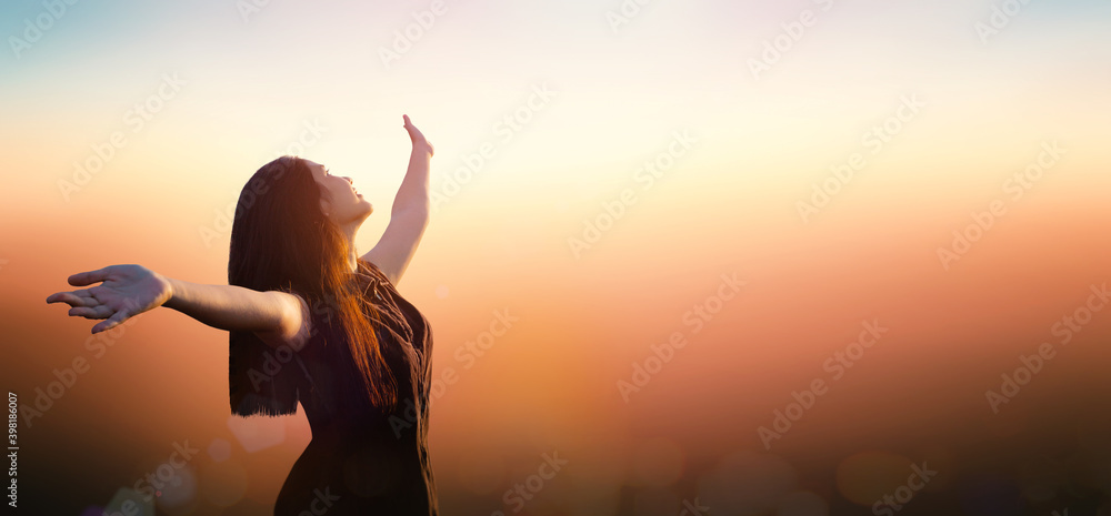 Worship God concept: Happy girl on blurred mountain sunrise background ...
