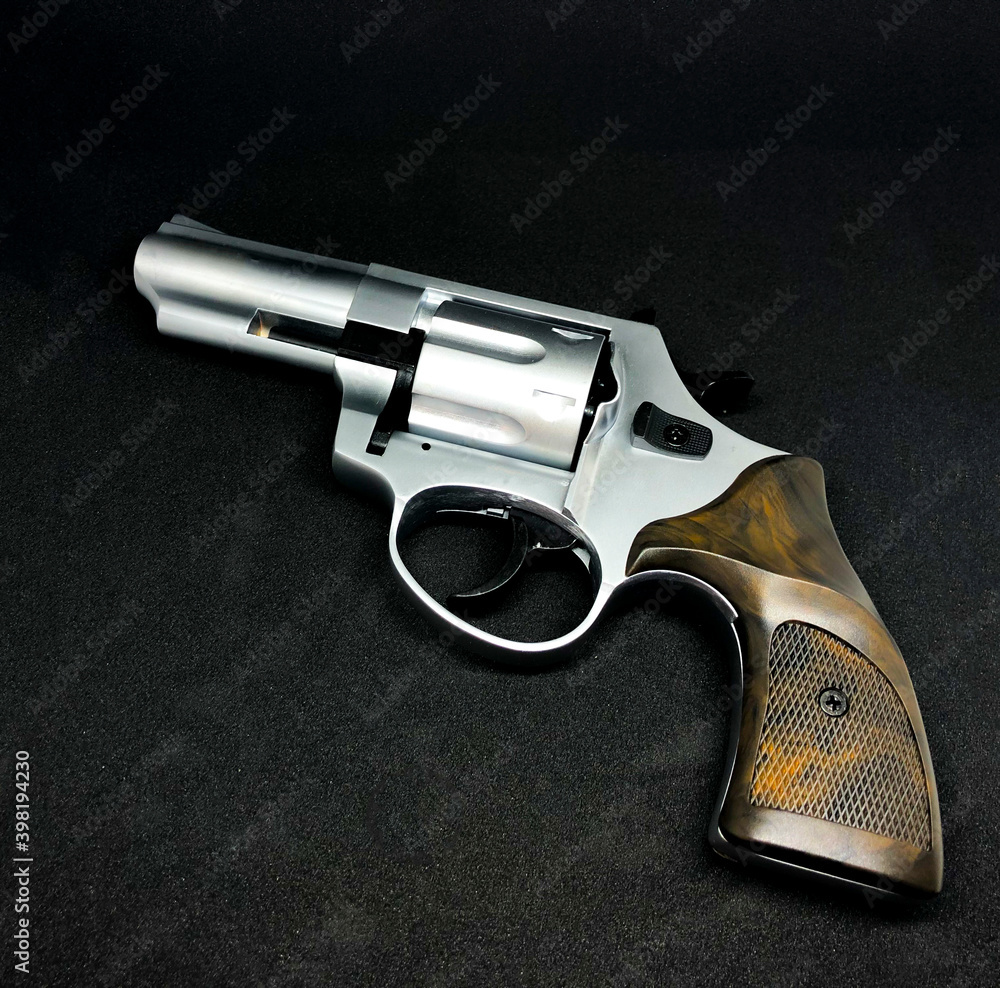 Hand gun top view on black background. 9mm pistol with ammo on the dark ...