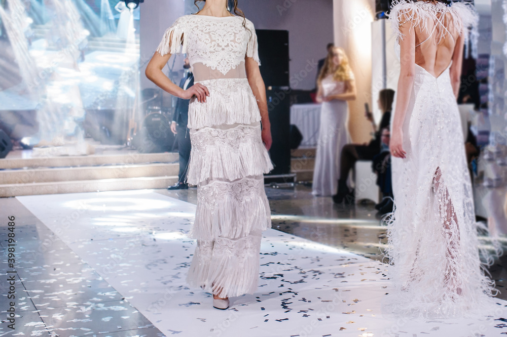 Female models walk the runway in beautiful stylish white wedding ...